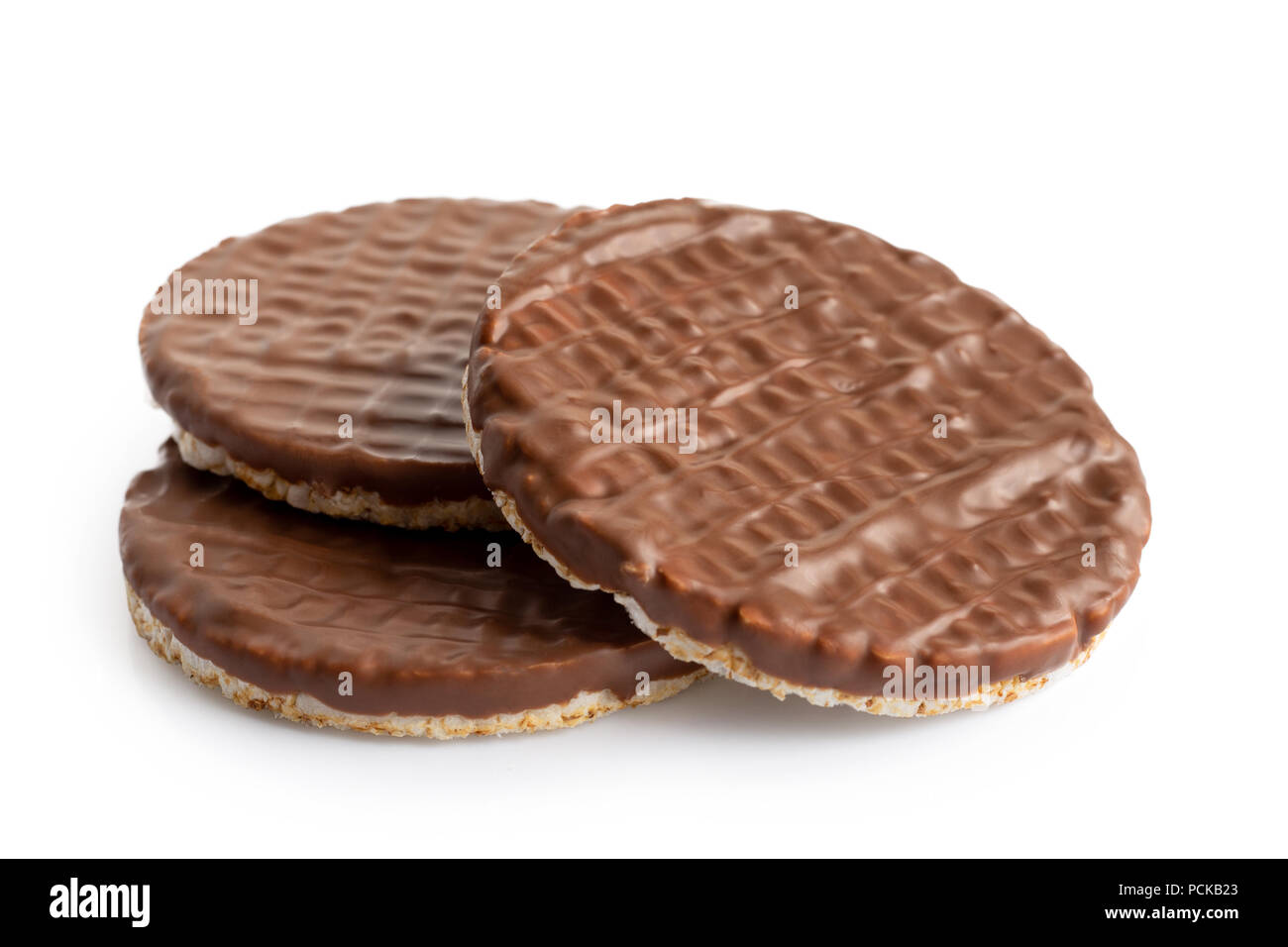 Pile of three chocolate rice cakes isolated on white Stock Photo - Alamy