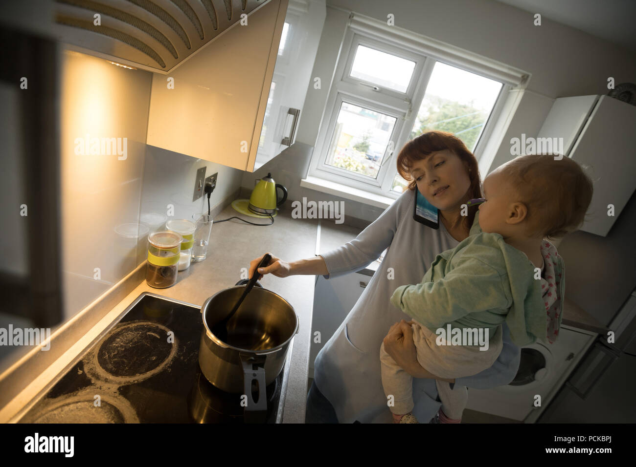 Baby cooking phone hi-res stock photography and images - Alamy