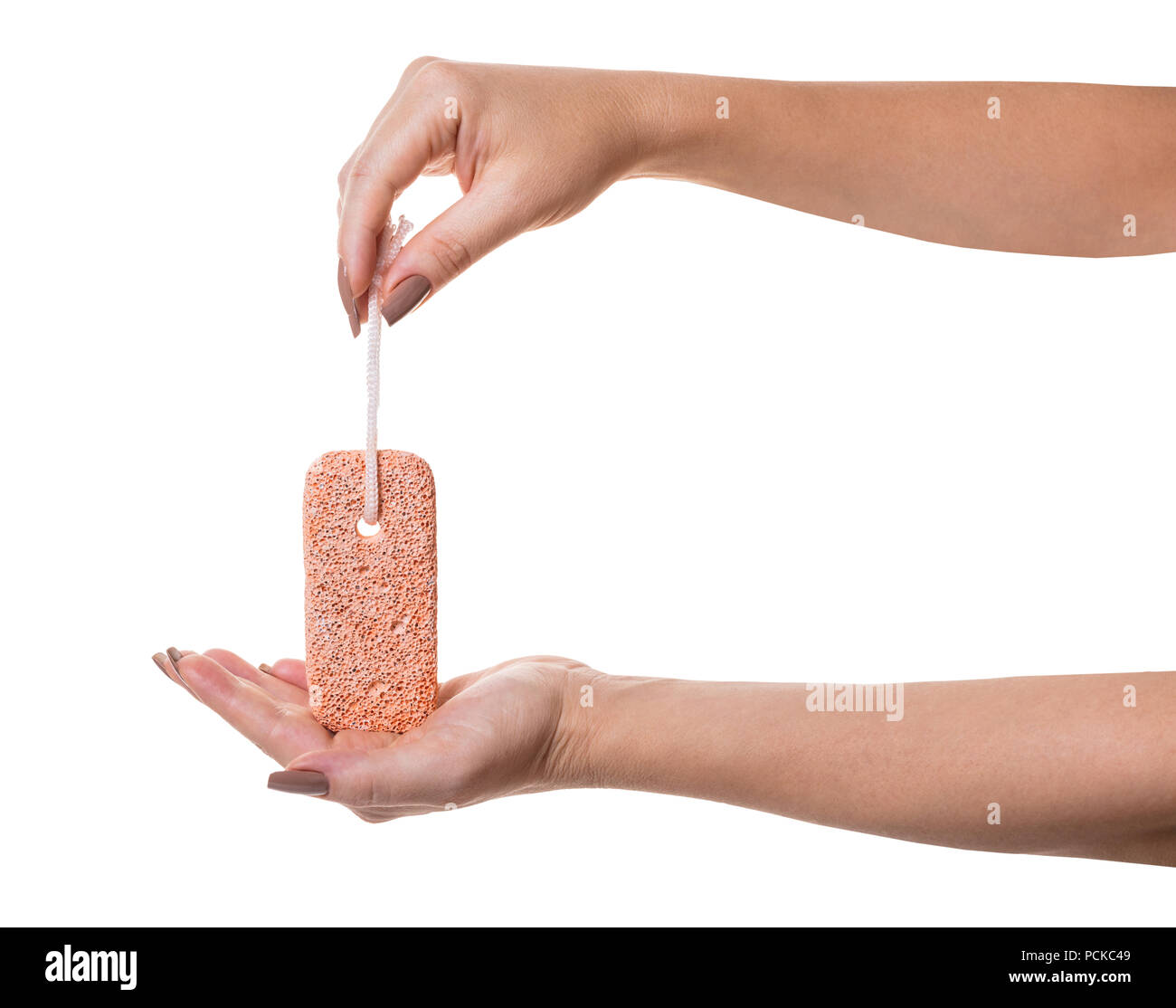 pumice stone in female hand on white isolated background Stock Photo ...
