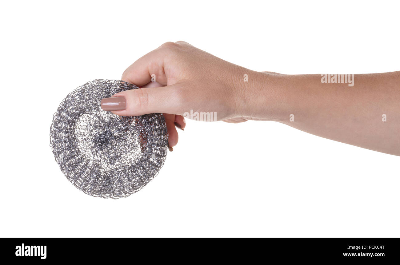 metal sponge for utensils in a female hand on white isolated background ...