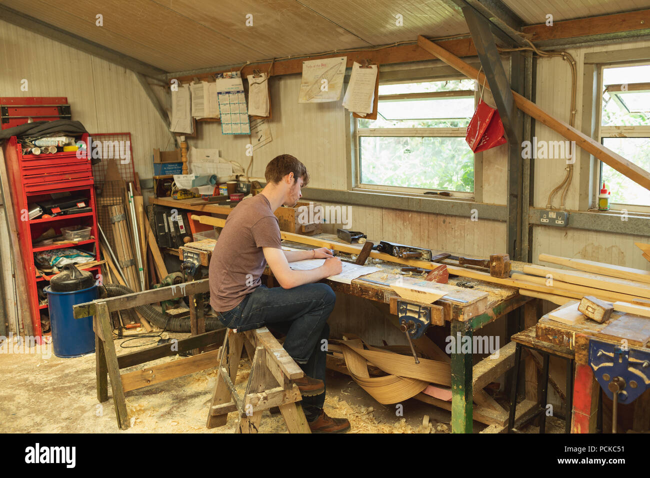 Male carpenter working in workshop Stock Photo - Alamy