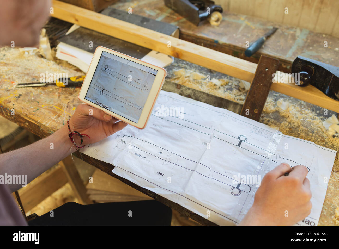 Male carpenter working in workshop Stock Photo - Alamy