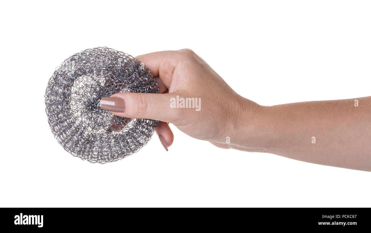 metal sponge for utensils in a female hand on white isolated background ...