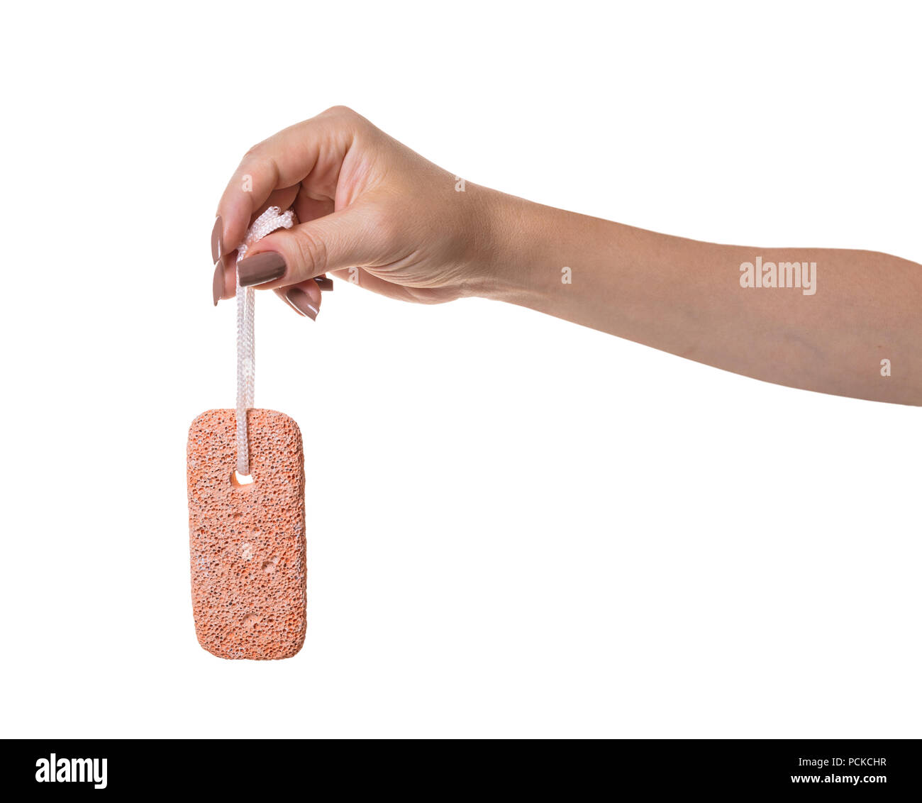 pumice stone in female hand on white isolated background Stock Photo ...