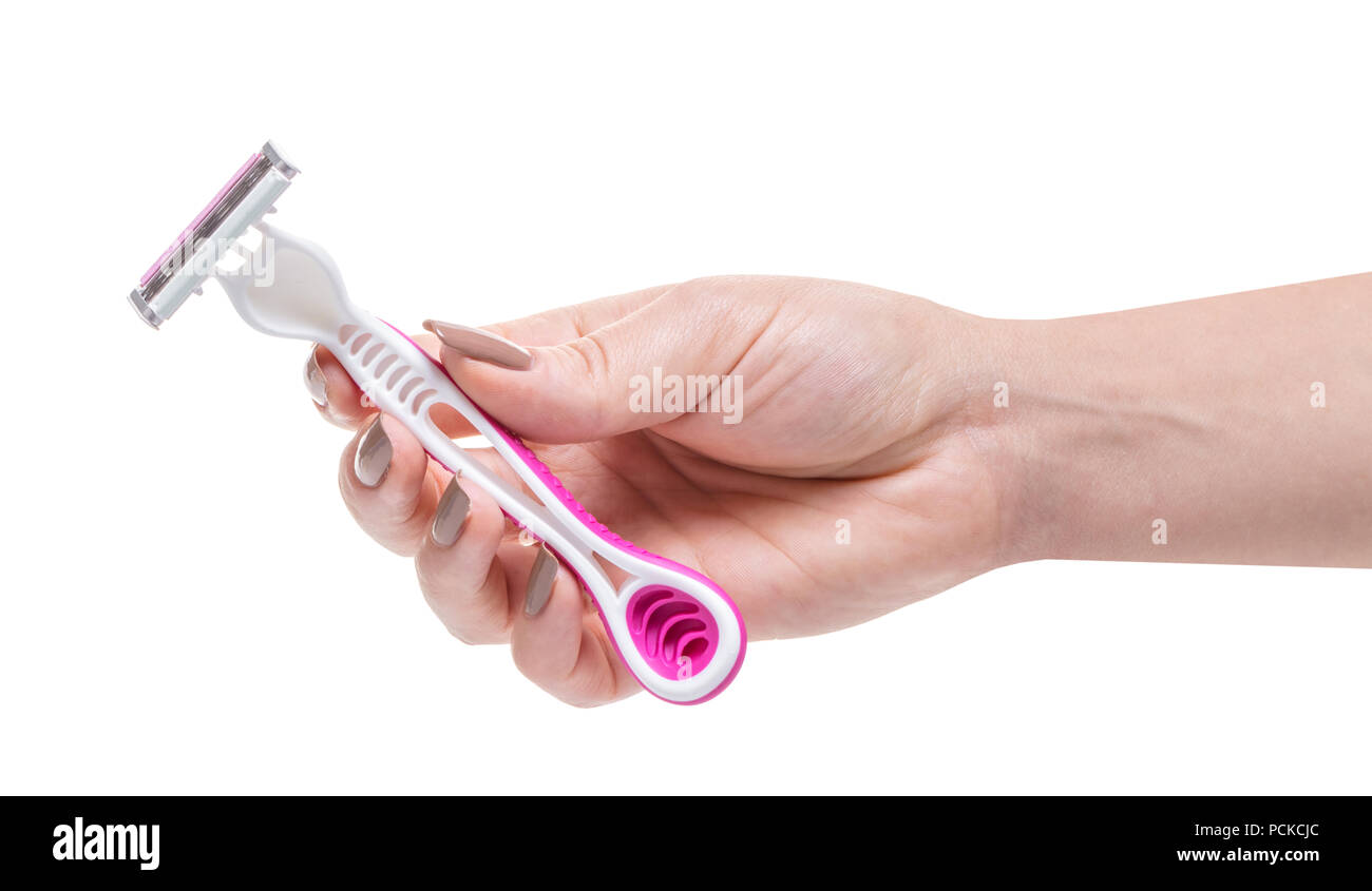 razor in a female hand on white isolated background Stock Photo - Alamy