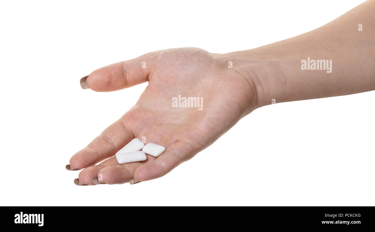 chewing gum in a female hand on white isolated background Stock Photo ...
