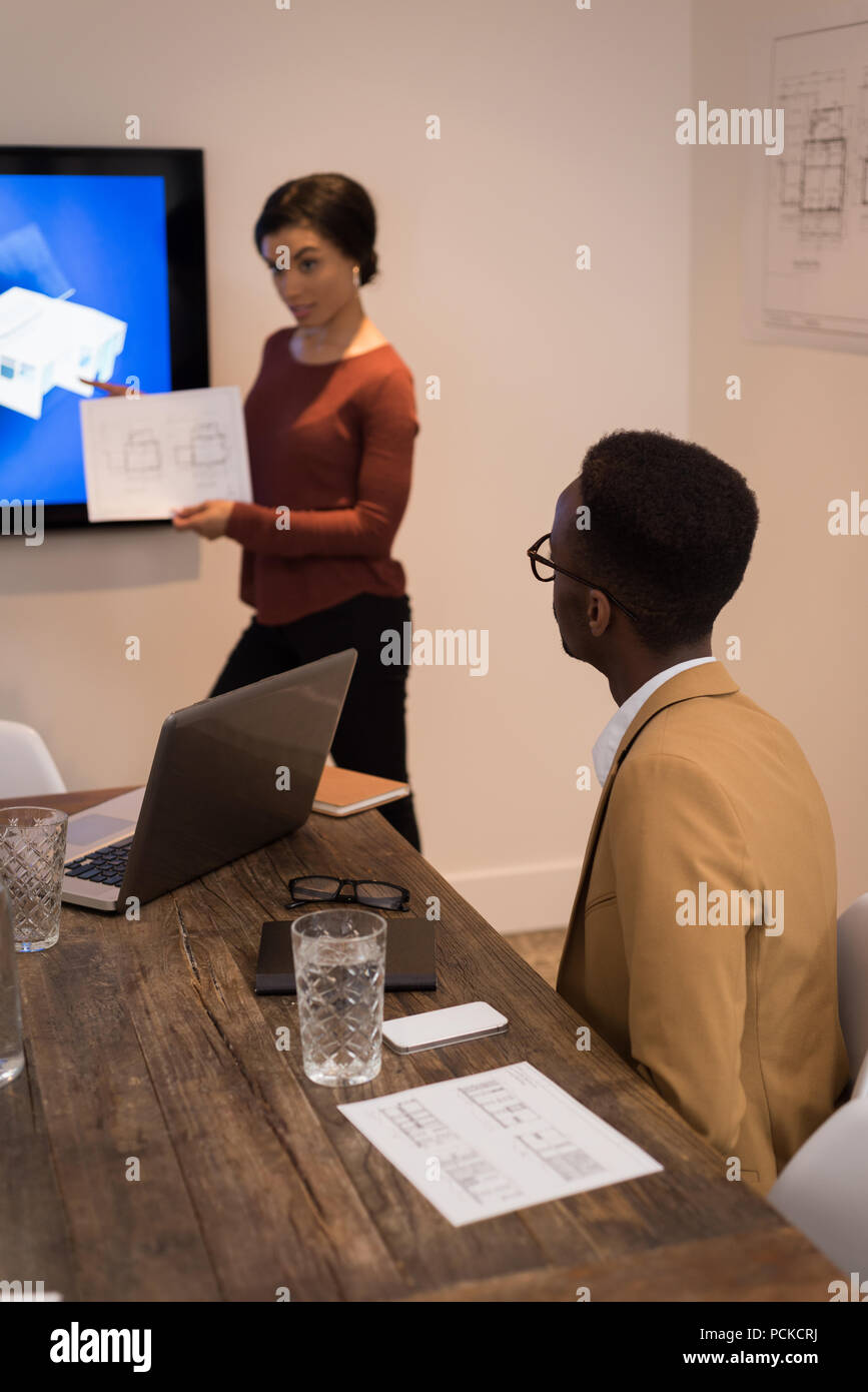Executive giving a presentation in the meeting room Stock Photo - Alamy