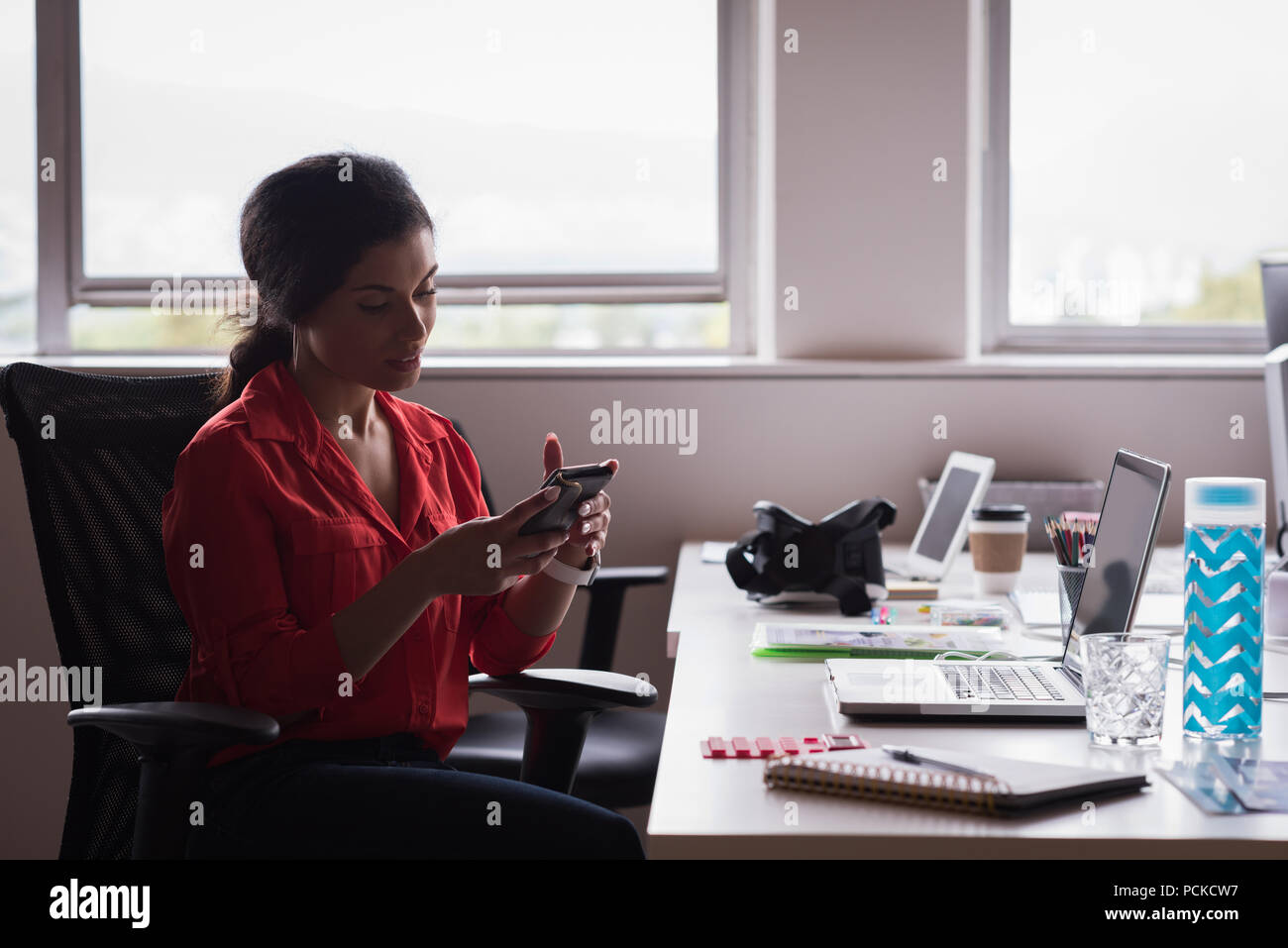 Desk woman headset phone hi-res stock photography and images - Alamy