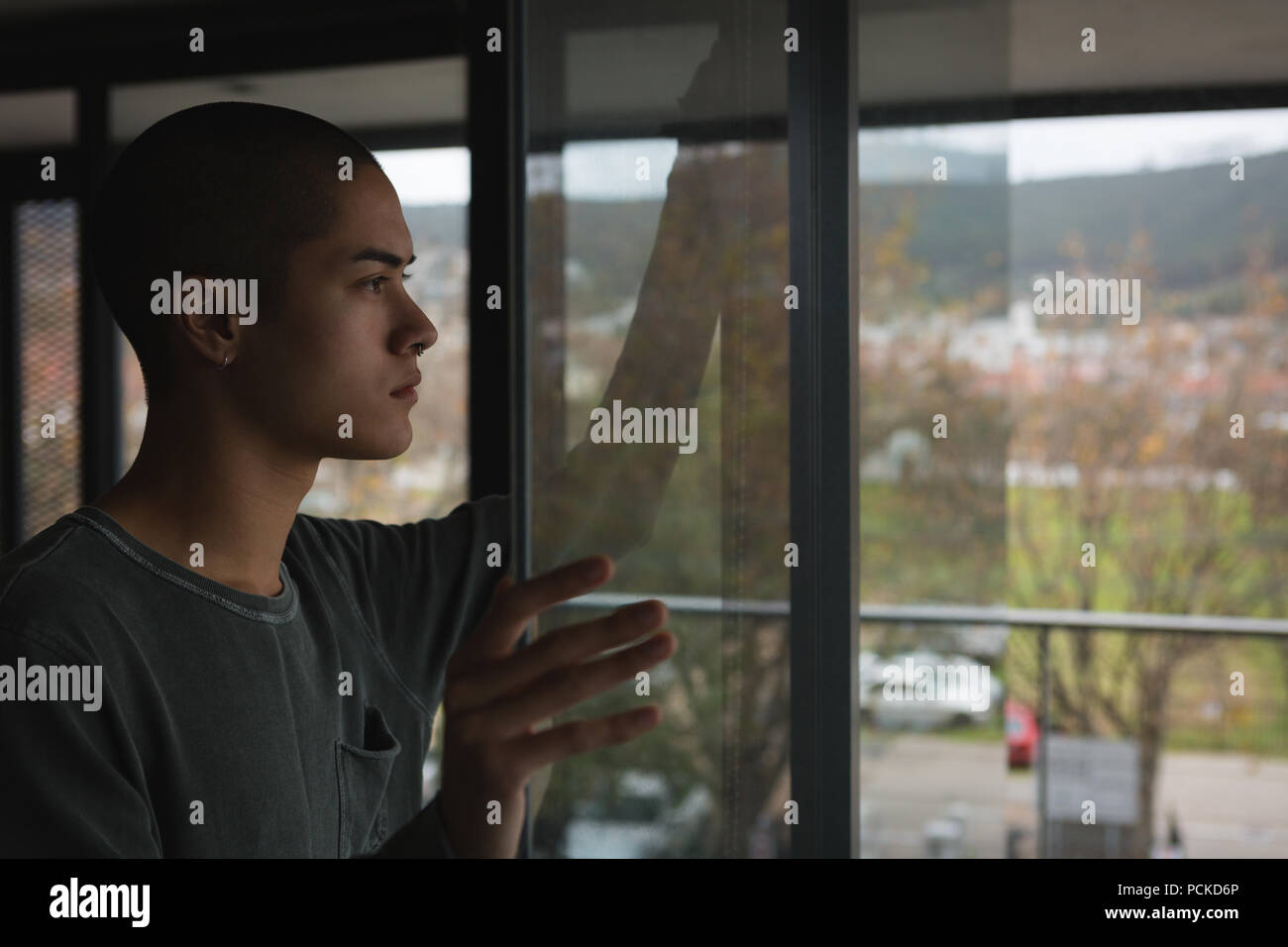 Stylish young man standing window hi-res stock photography and images ...