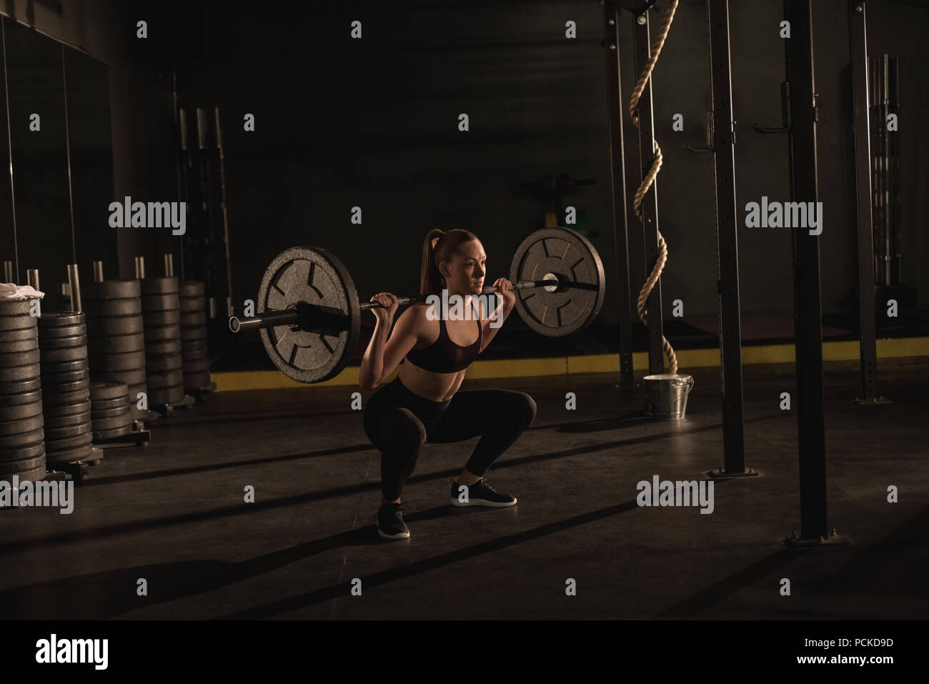 Woman lifting the barbell hi-res stock photography and images - Alamy