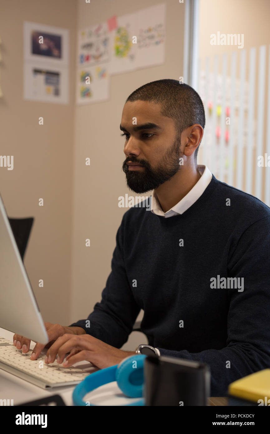 Mixed race man working computer hi-res stock photography and images - Alamy