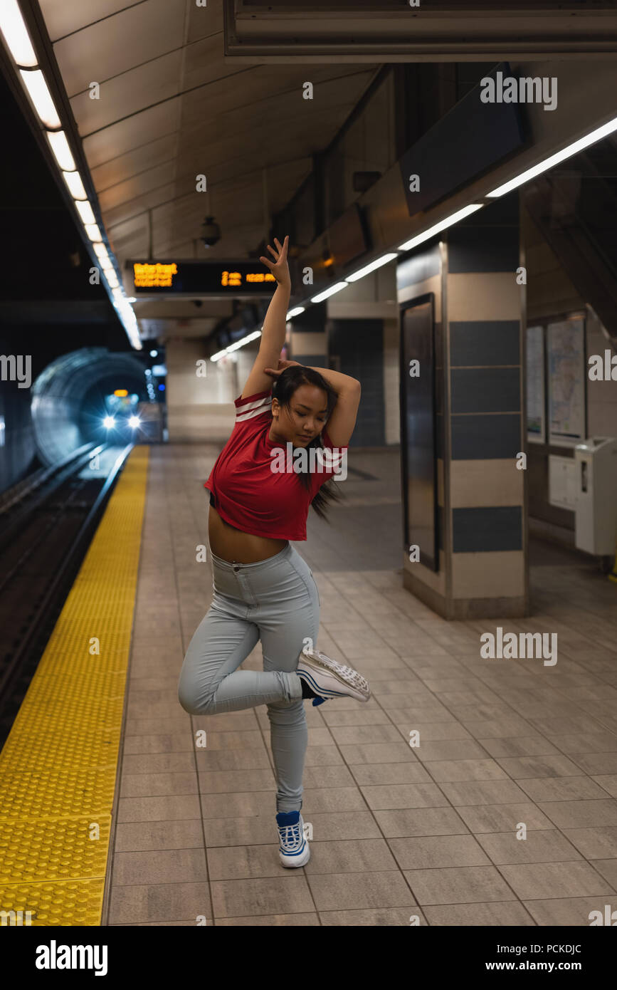 Female street dancer dancing on platform Stock Photo - Alamy