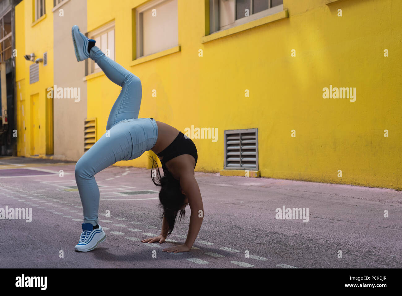 Female street dancer dancing in the street Stock Photo - Alamy