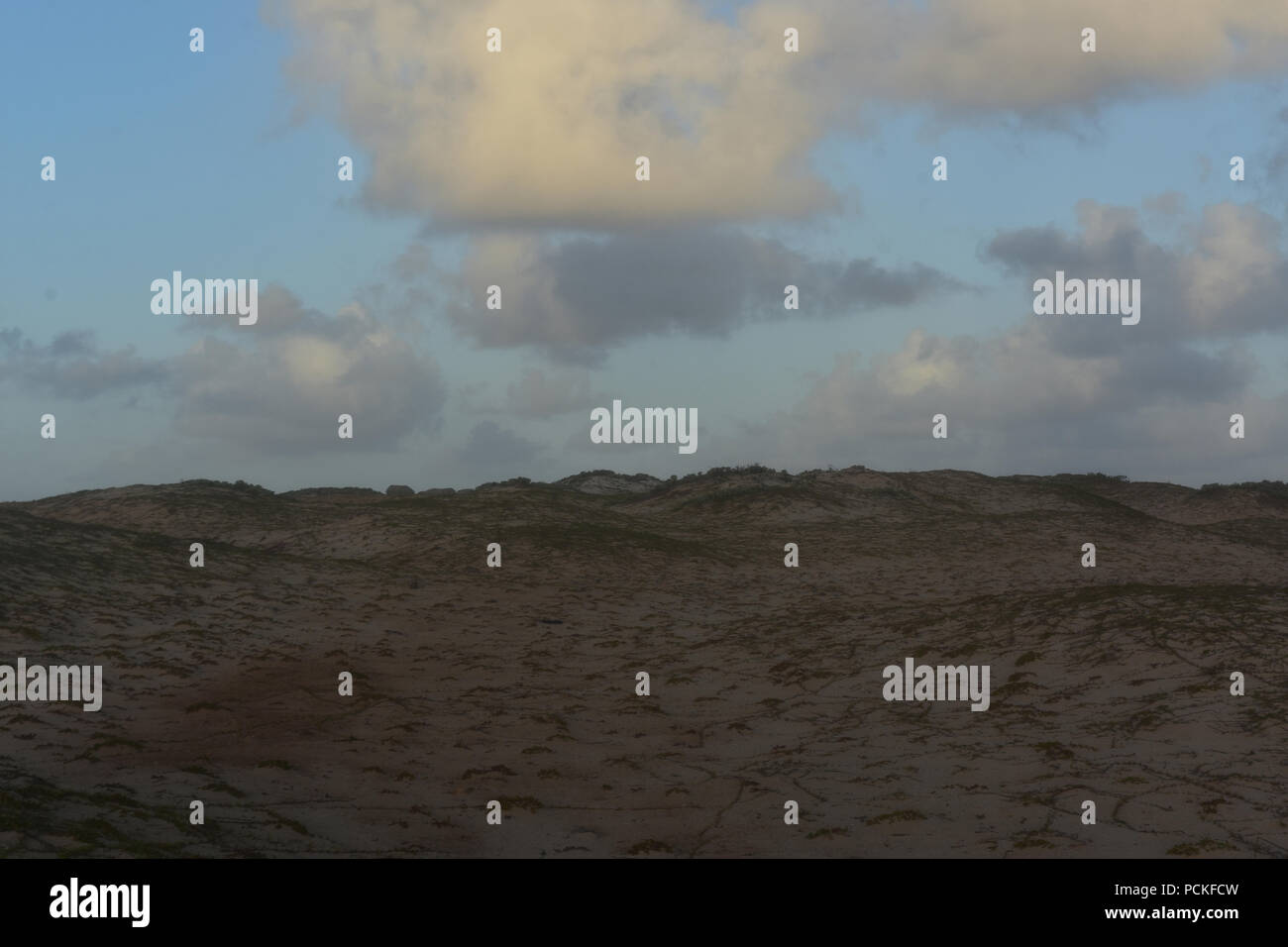 Aruba rolling sand dunes with pretty skies Stock Photo - Alamy