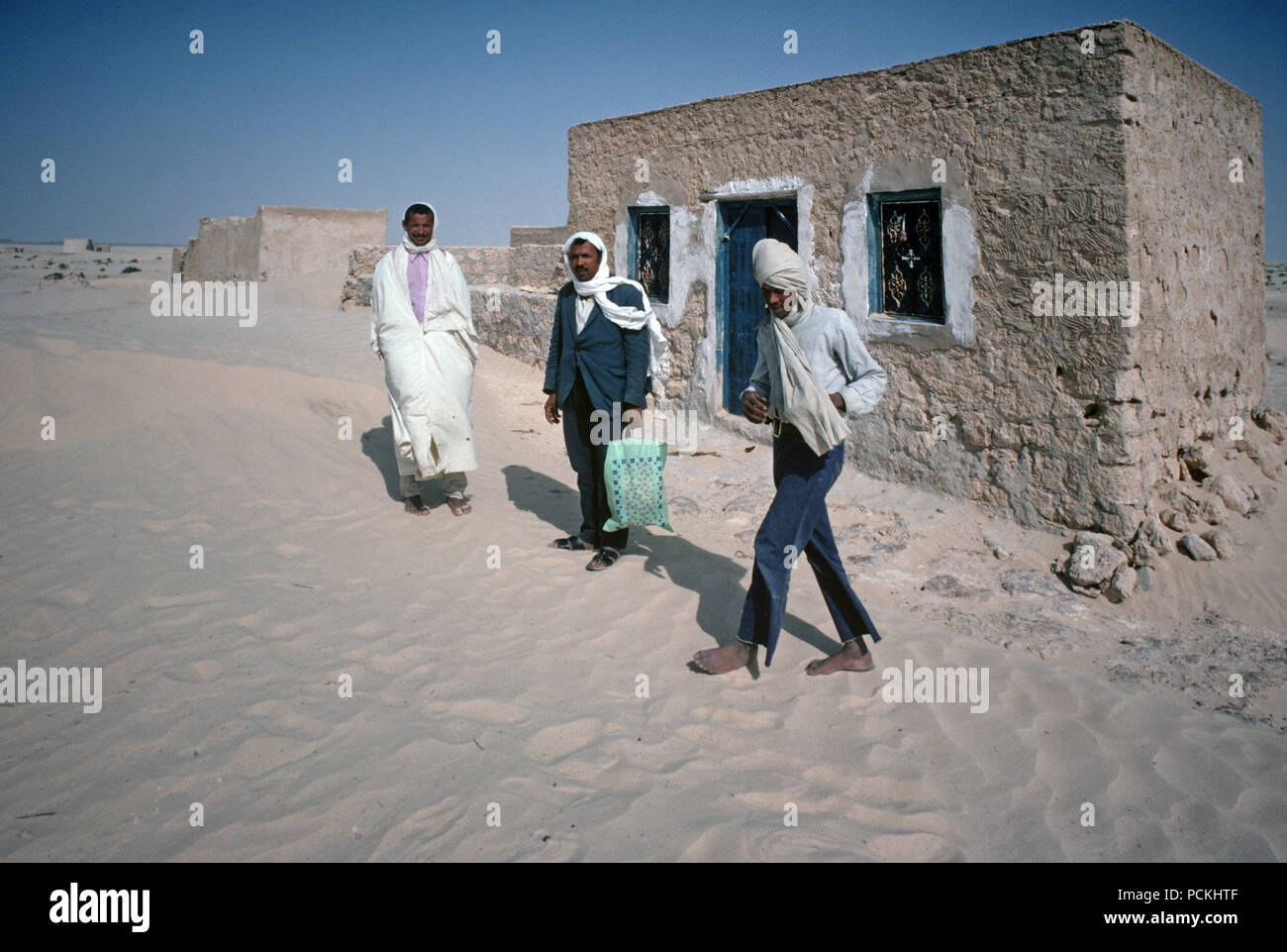 Arab Berbers infront of Sahara desert dwelling, South Tunisia, Tunisia ...