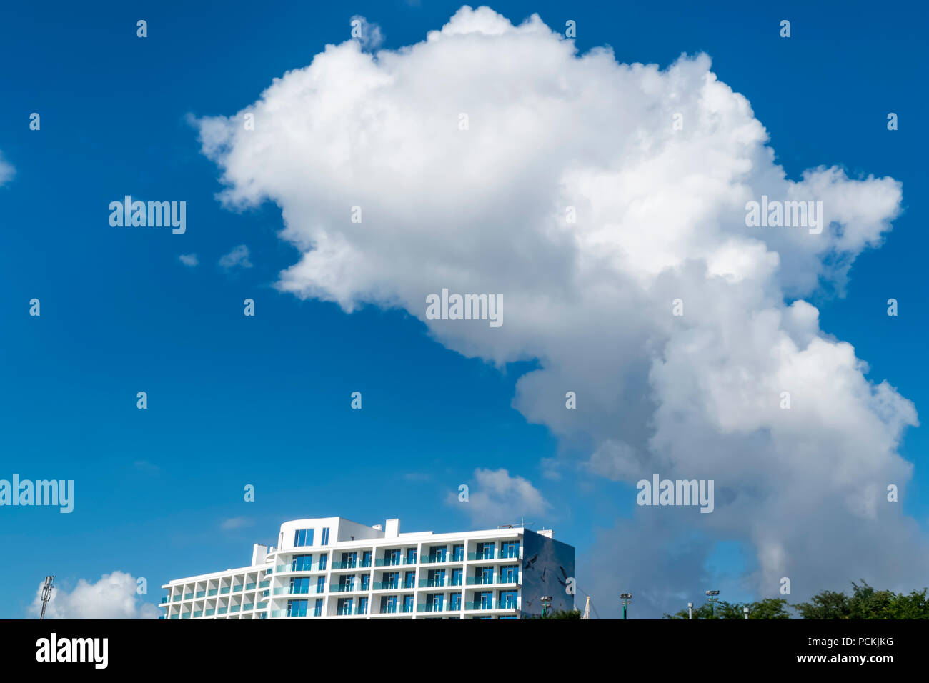 Blue cloudy sky above the hotel roof in the resort Stock Photo - Alamy