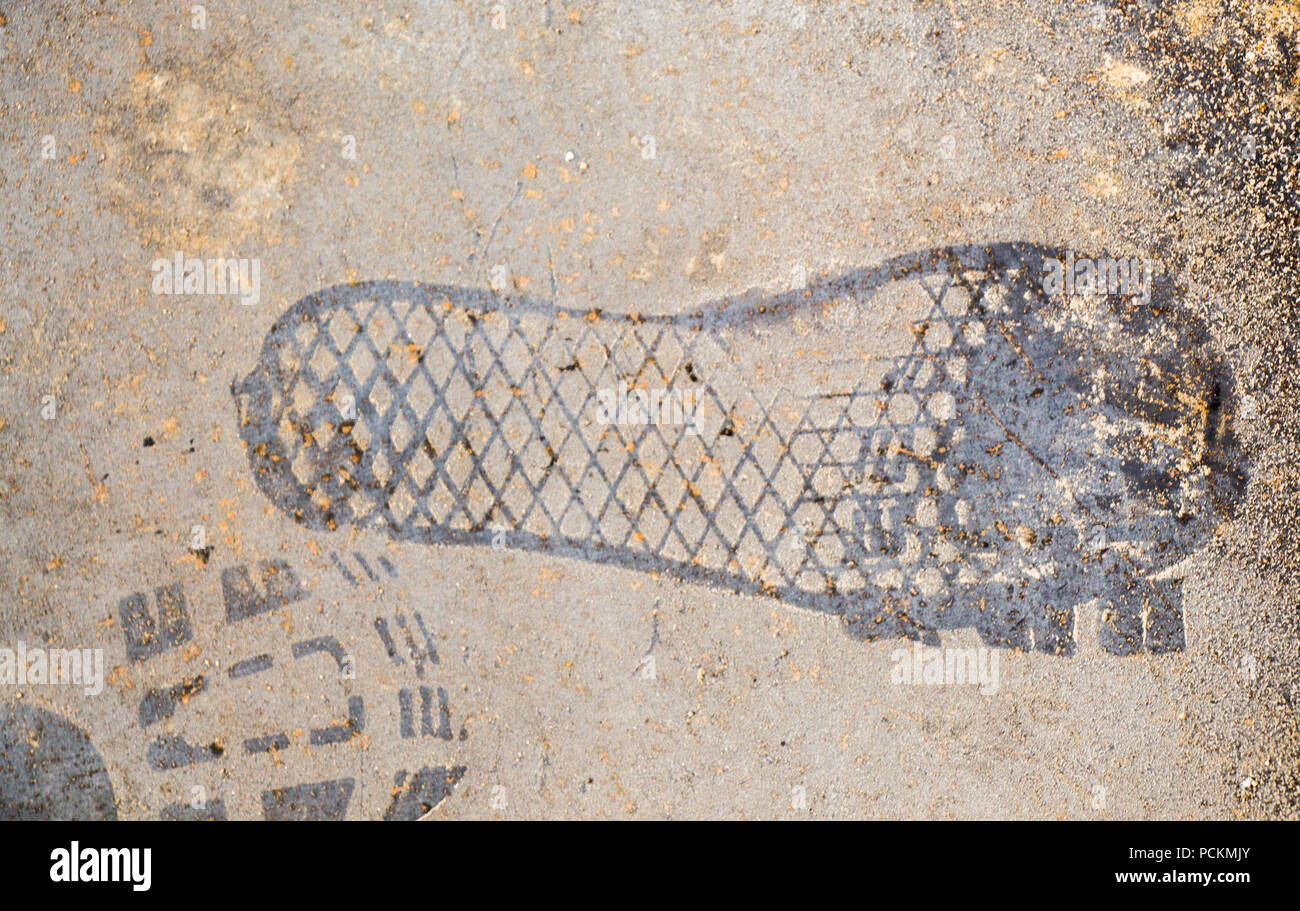 Footstep pattern seen on a concrete background Stock Photo - Alamy