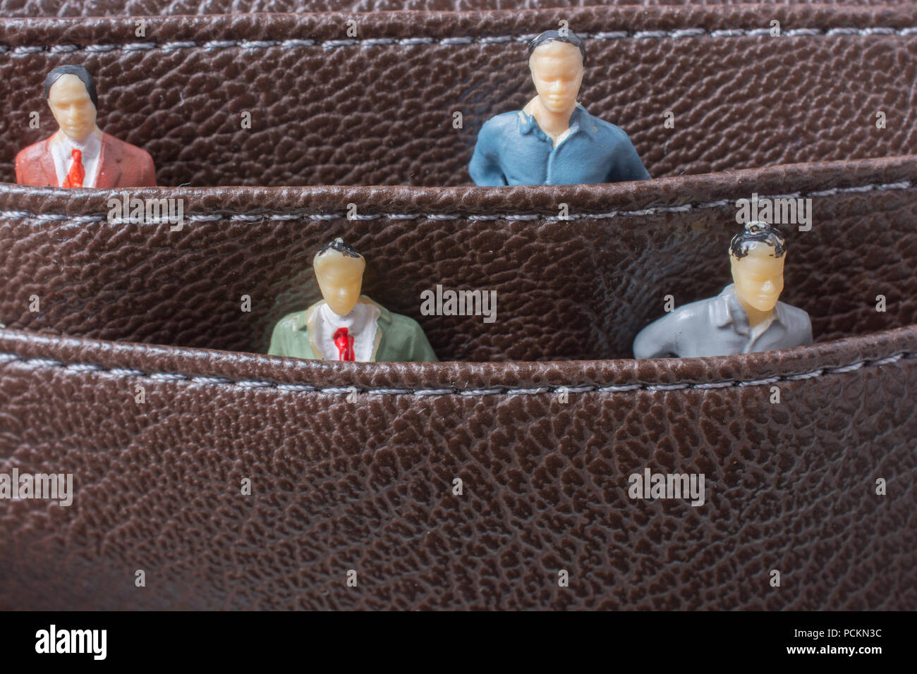 Tiny figurine of group of men miniature model in pockets Stock Photo ...