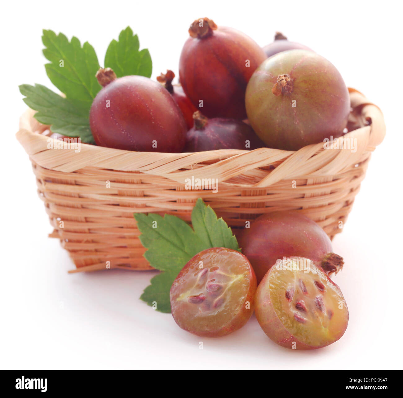 Fresh ripe gooseberry in basket over white background Stock Photo - Alamy