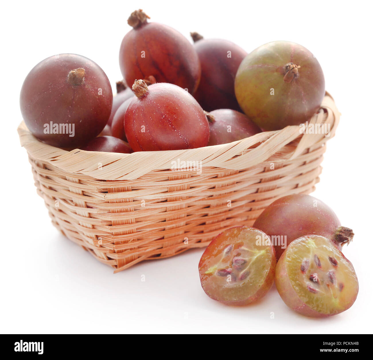 Fresh ripe gooseberry in basket over white background Stock Photo - Alamy