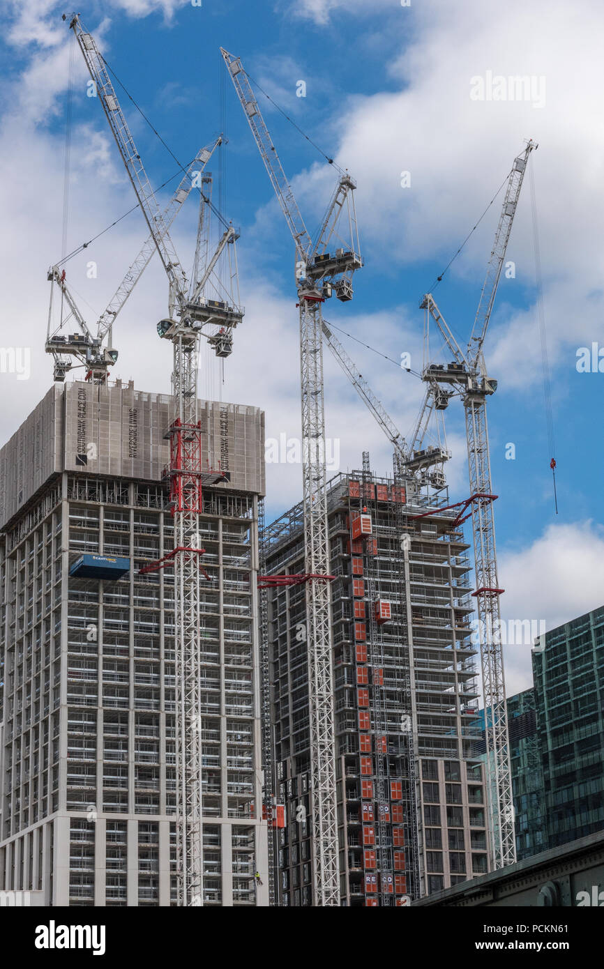 cranes on building sites in central London. construction cranes working ...