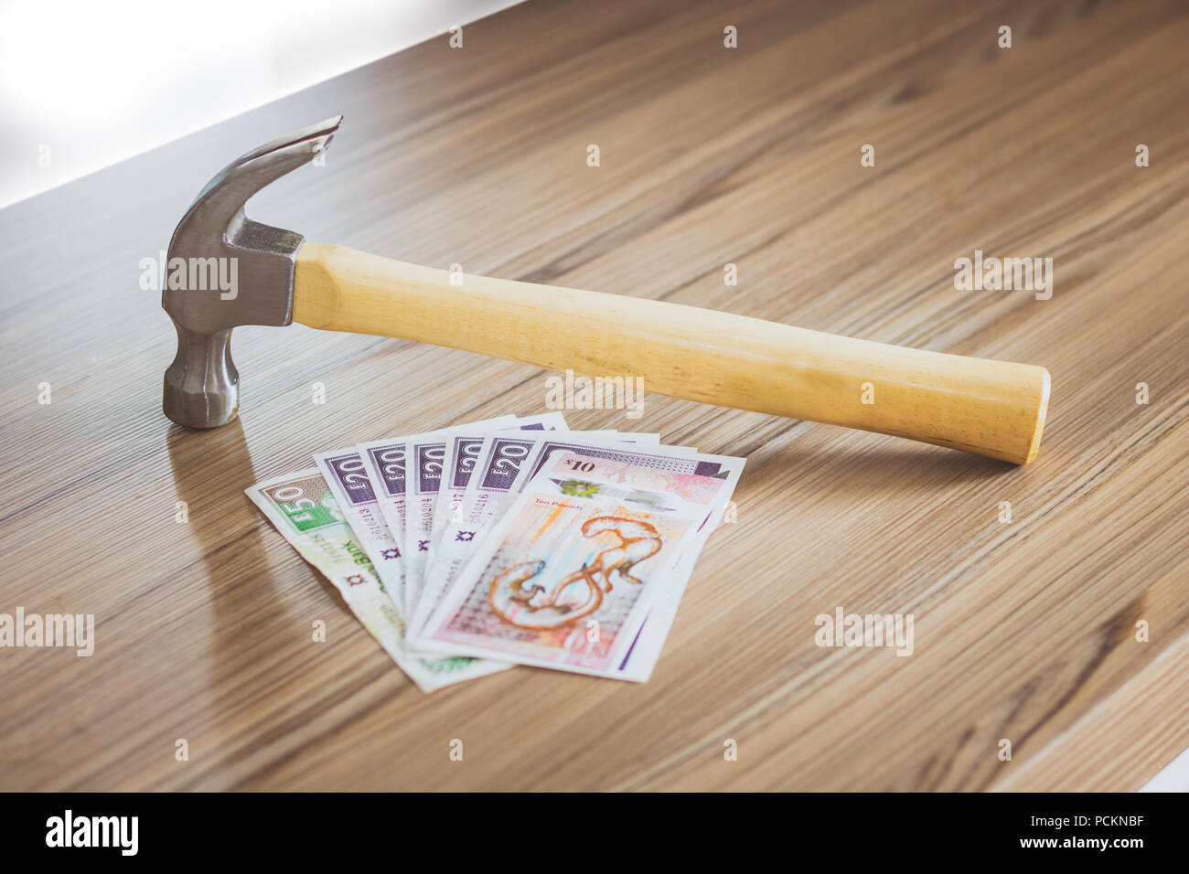 Hammer and money Stock Photo - Alamy
