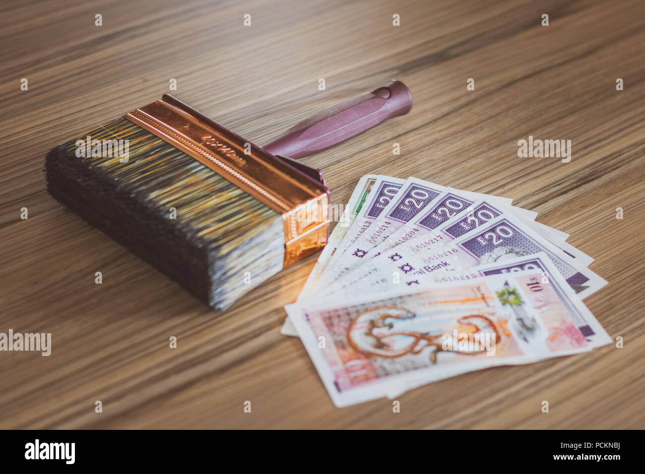 Paint brush and money Stock Photo - Alamy