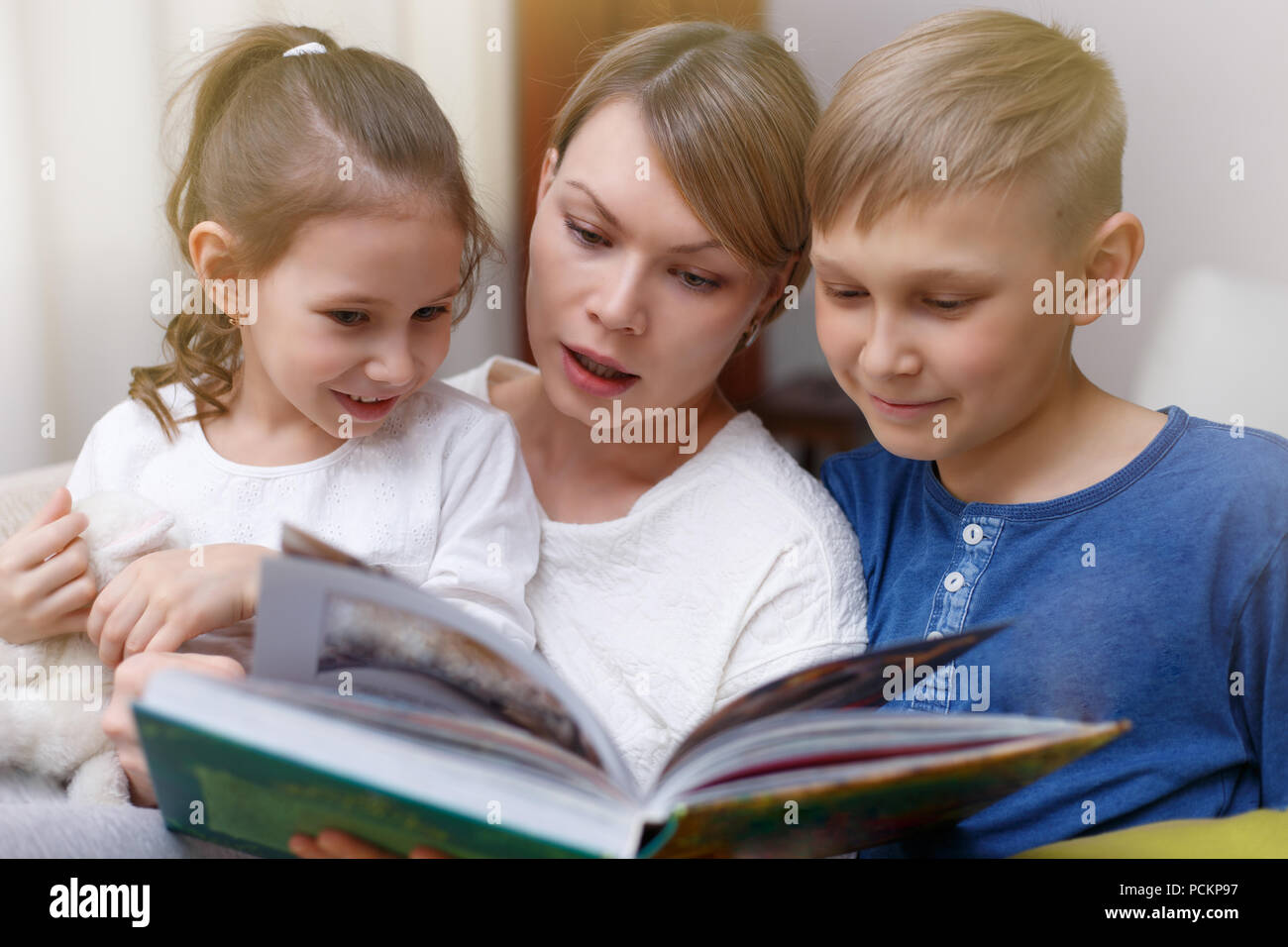 Woman reading bedtime story children hi-res stock photography and ...