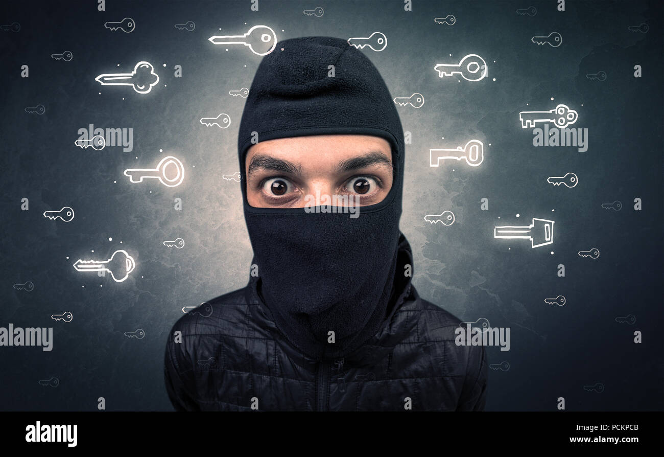 Burglar standing with tools in his hand Stock Photo - Alamy
