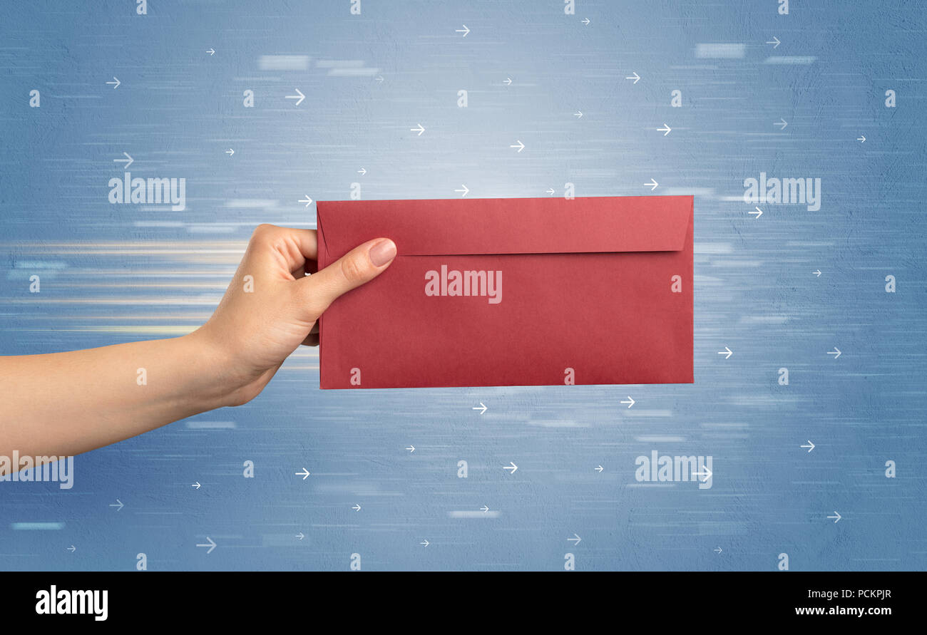 Female hand holding empty and full envelope with blue background and ...