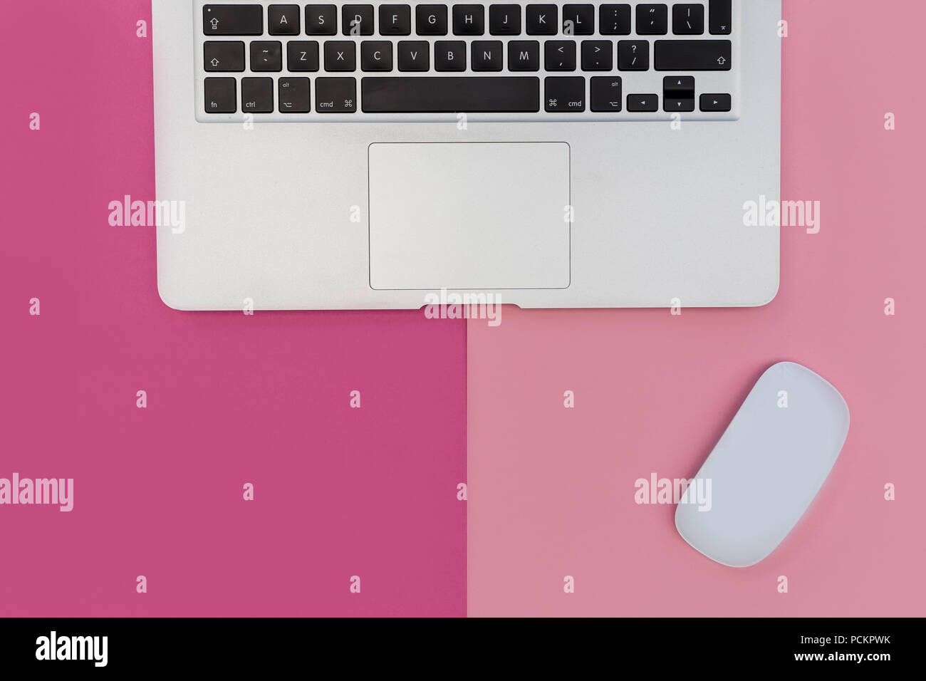 Laptop computer mouse on bright pink background Stock Photo - Alamy
