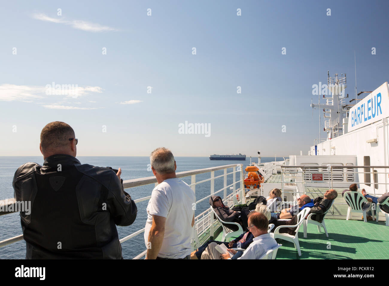 Passengers on a cross channel ferry Stock Photo - Alamy