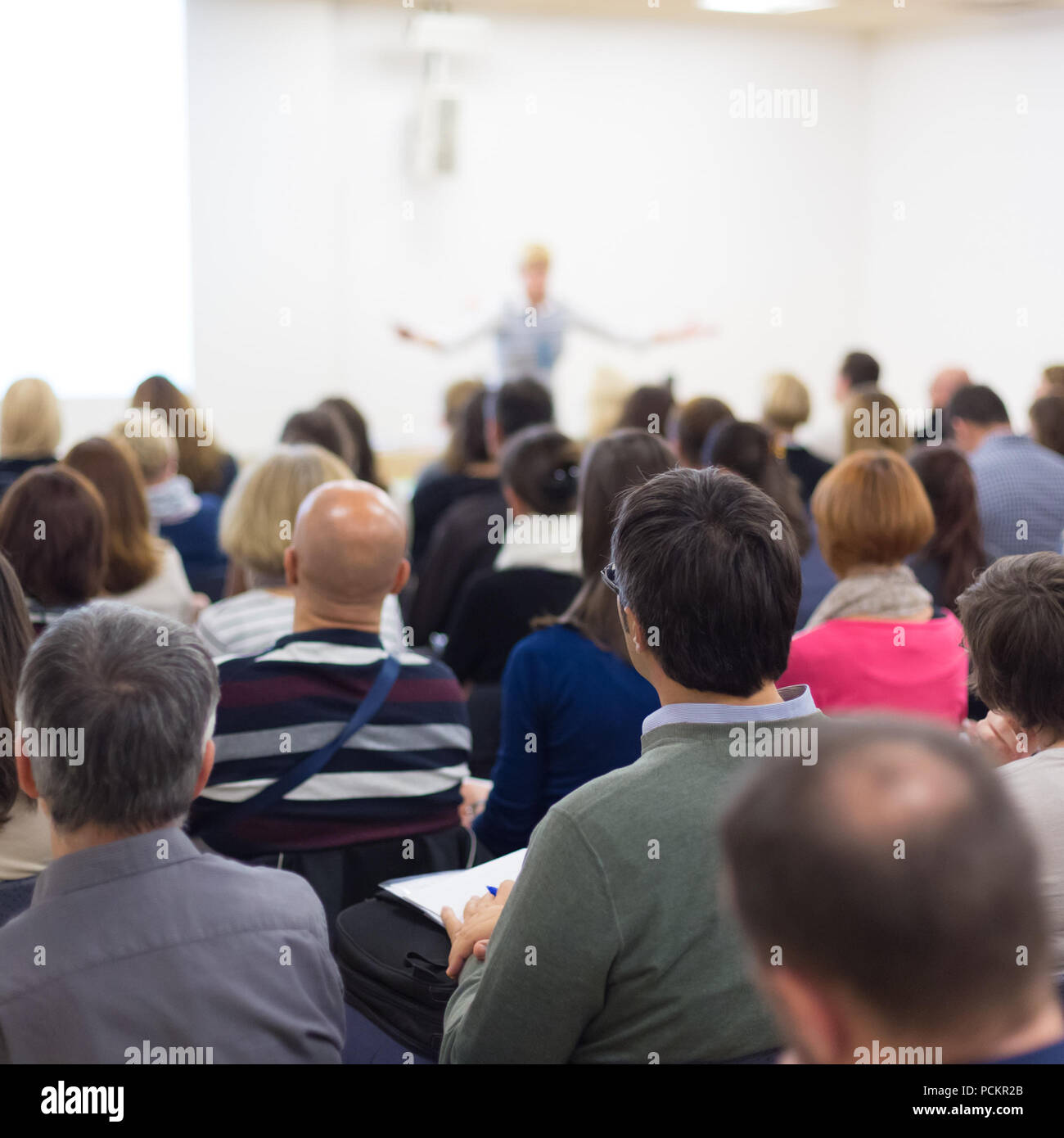 Woman giving presentation on business conference Stock Photo - Alamy