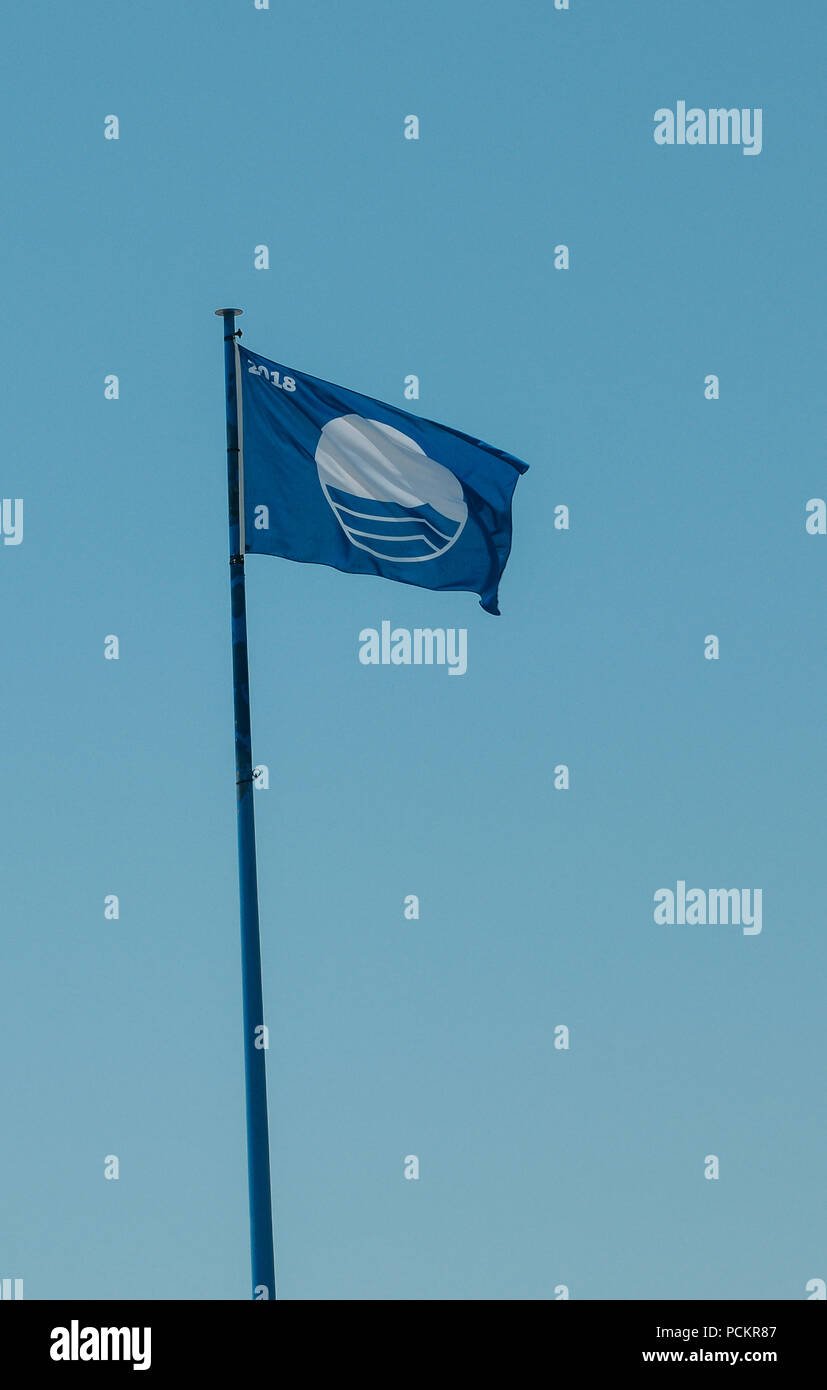 Blue Flag against blue sky. Blue Flag is an international award given ...