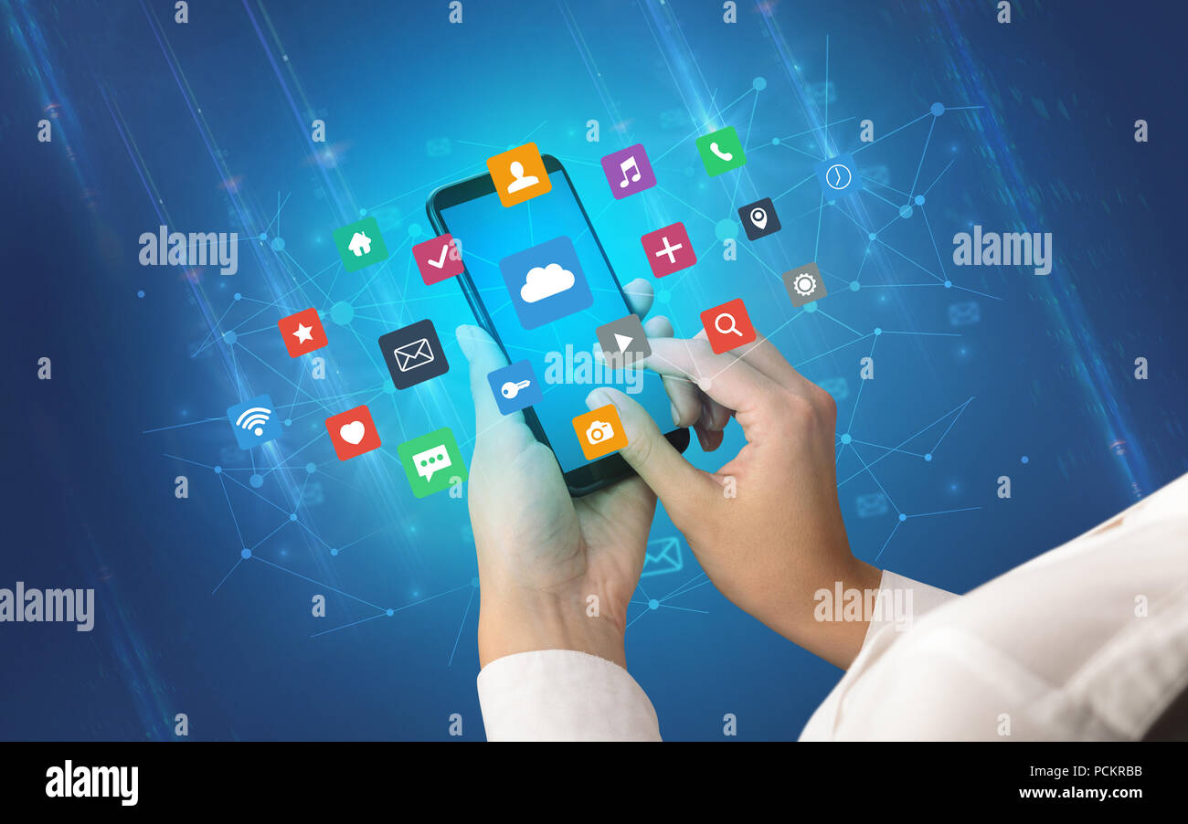 Female hand using smartphone with colorful application icons around ...