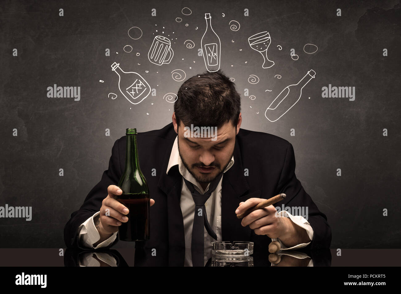 Drunk down and out man with doodle alcohol bottles concept Stock Photo ...