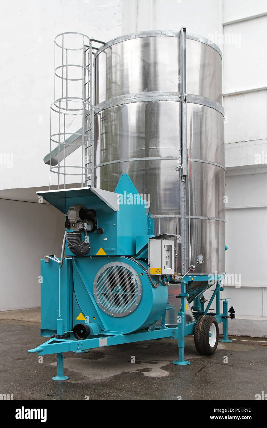 Cereal dryer silo at trailer in front of farm Stock Photo - Alamy