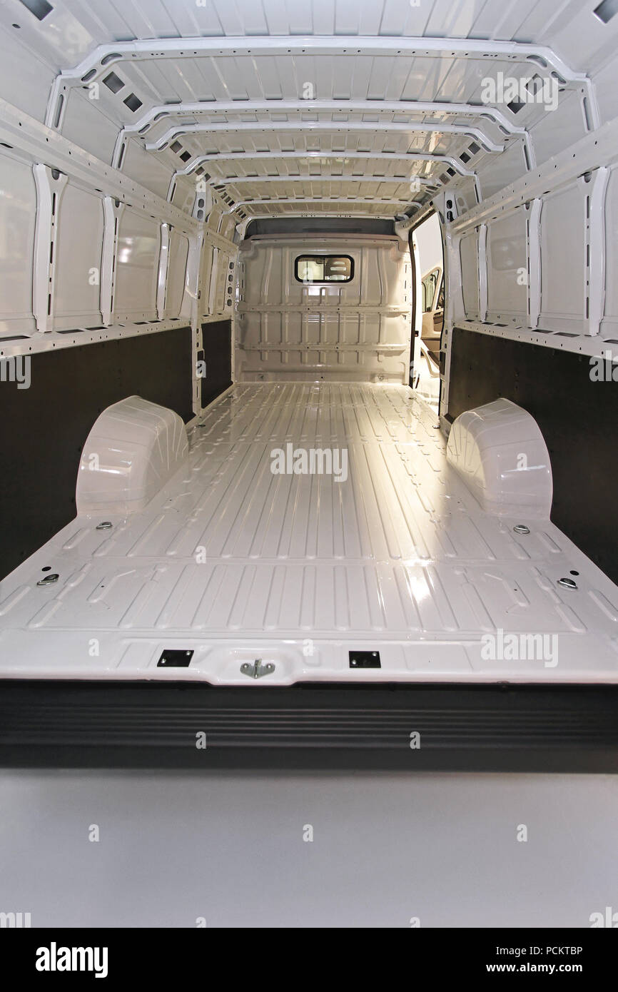 Empty long white delivery van transport Stock Photo - Alamy