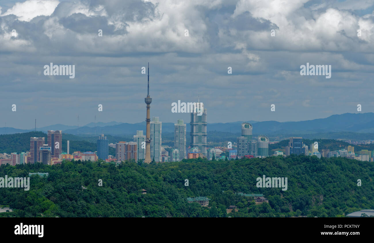 Parkland and skyline toward the mountains - Pyongyang skyline from the ...