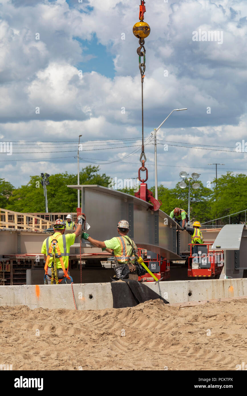 Detroit, Michigan - Workers set a girder in place while rebuilding a ...