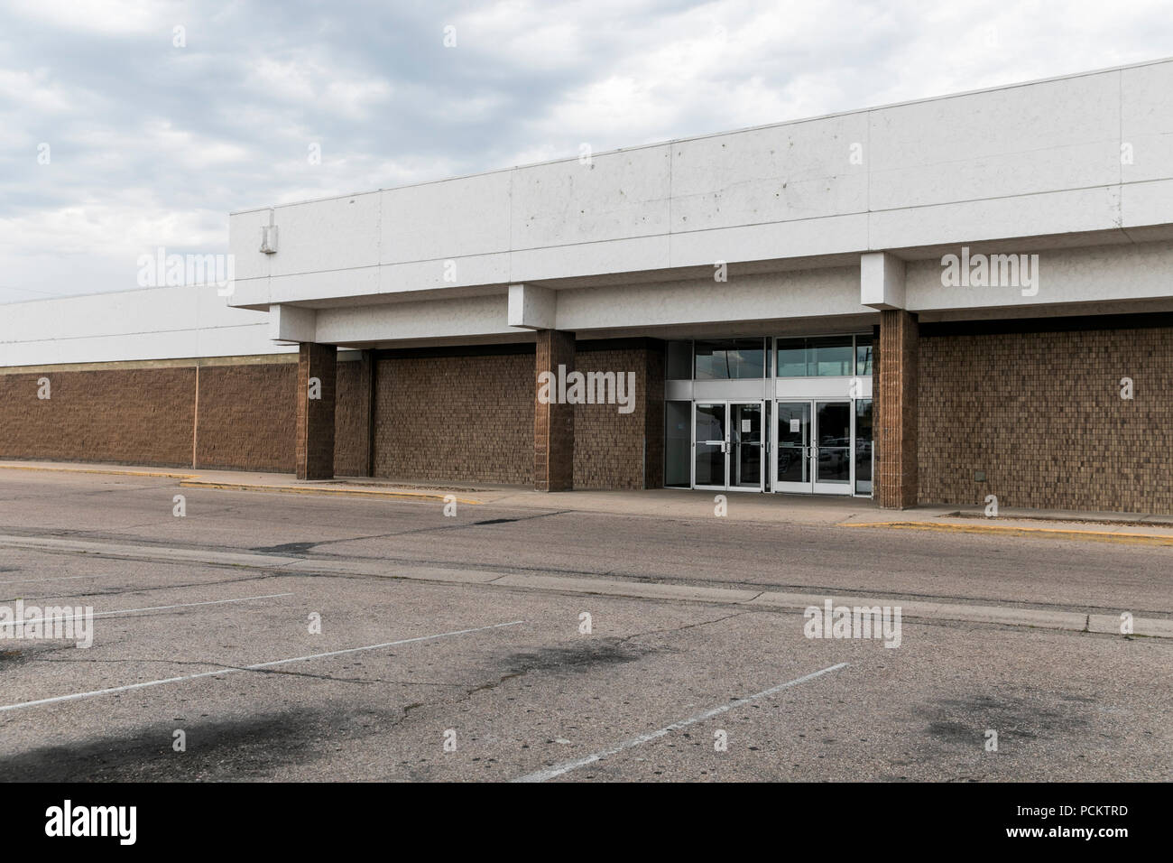 The outline of a logo sign at a closed Sears retail store location in ...