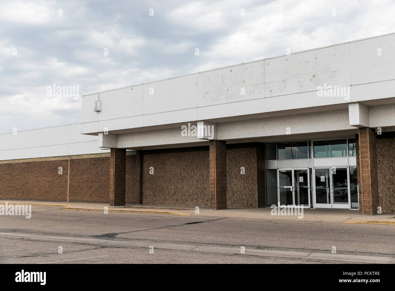 The outline of a logo sign at a closed Sears retail store location in ...