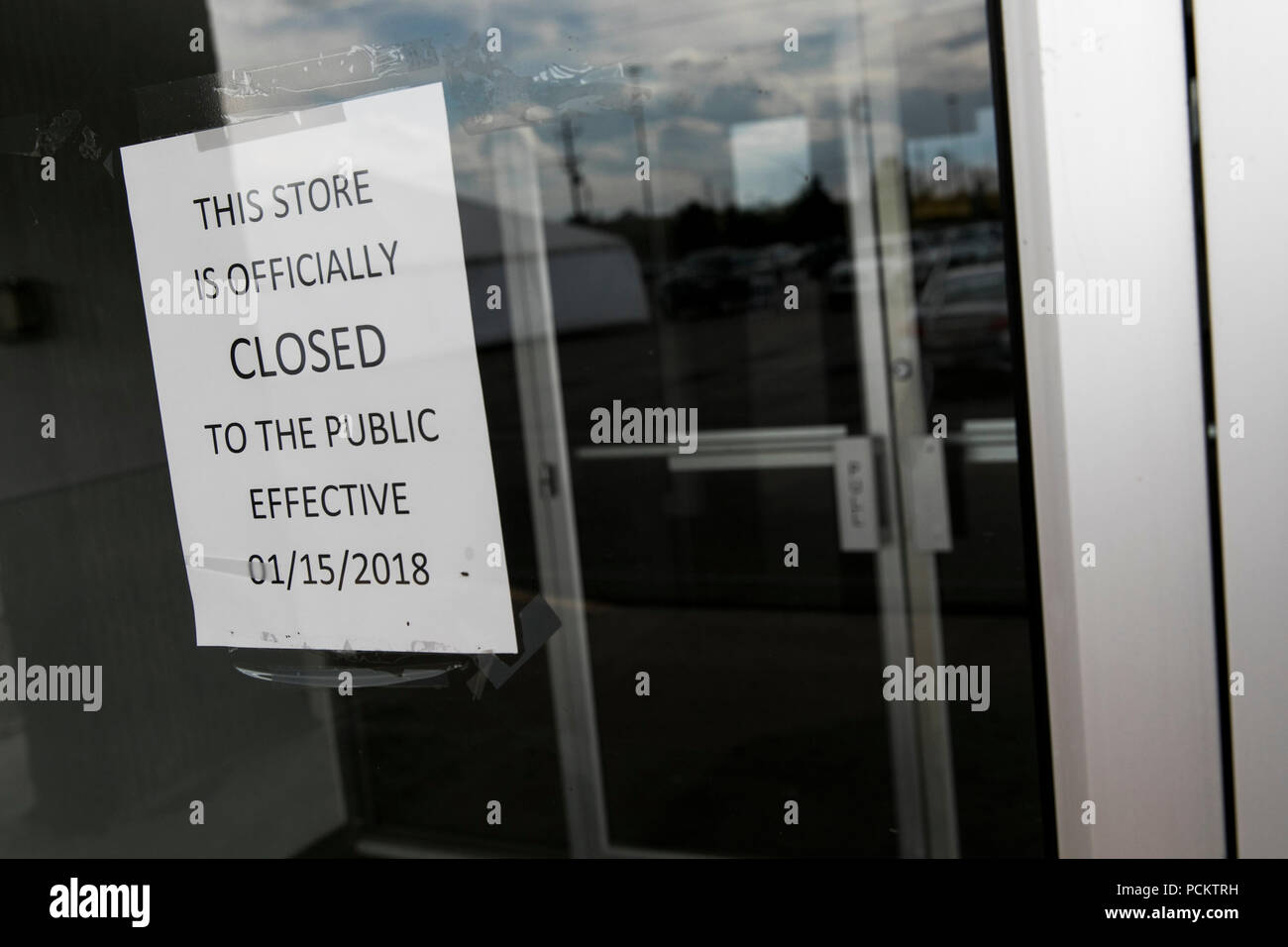 The outline of a logo sign at a closed Sears retail store location in ...