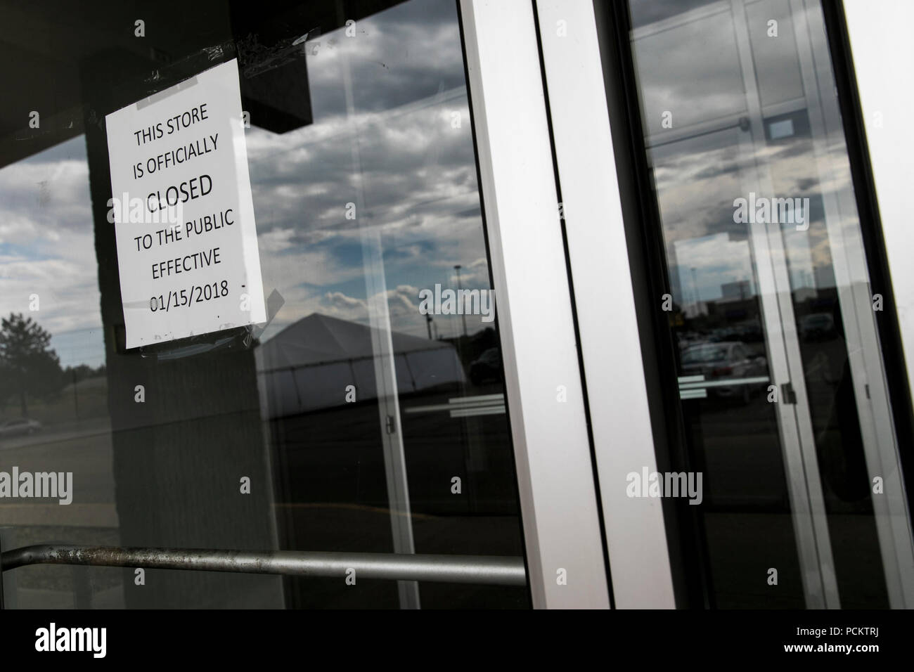 The outline of a logo sign at a closed Sears retail store location in ...