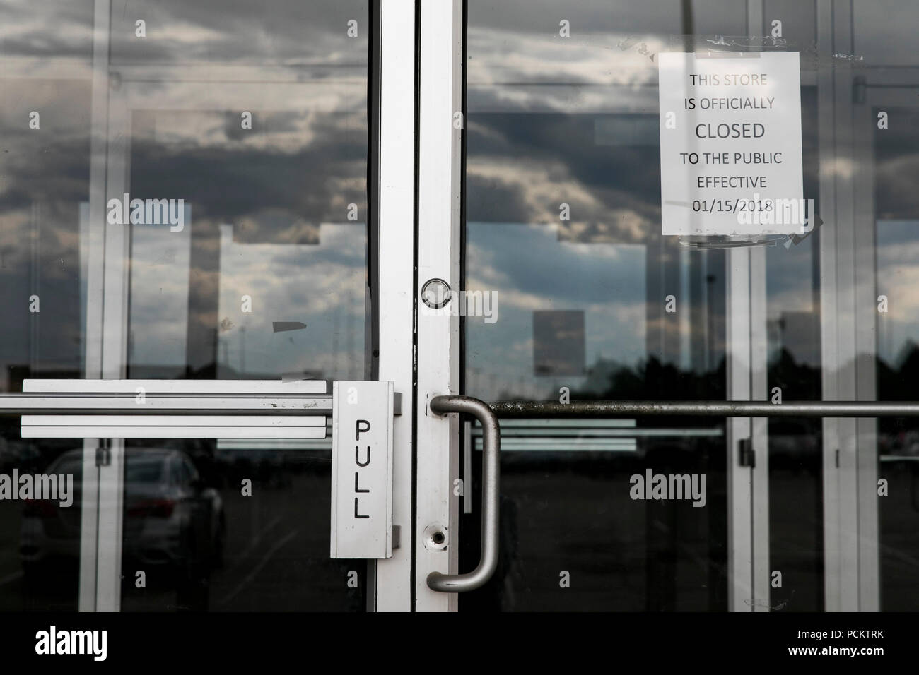 The outline of a logo sign at a closed Sears retail store location in ...