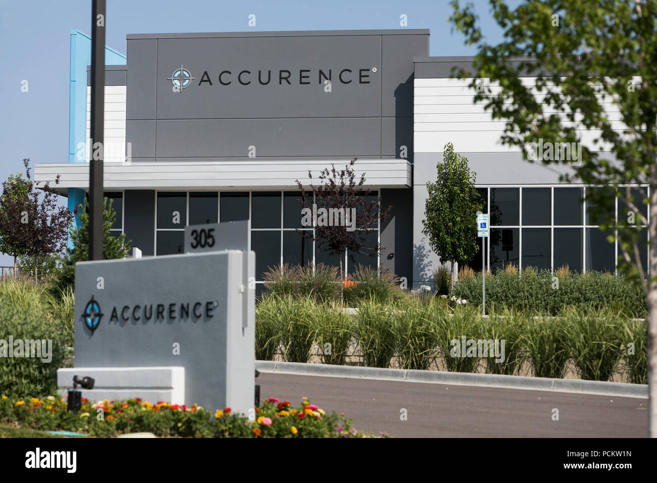 A logo sign outside of the headquarters of Accurence in Louisville ...