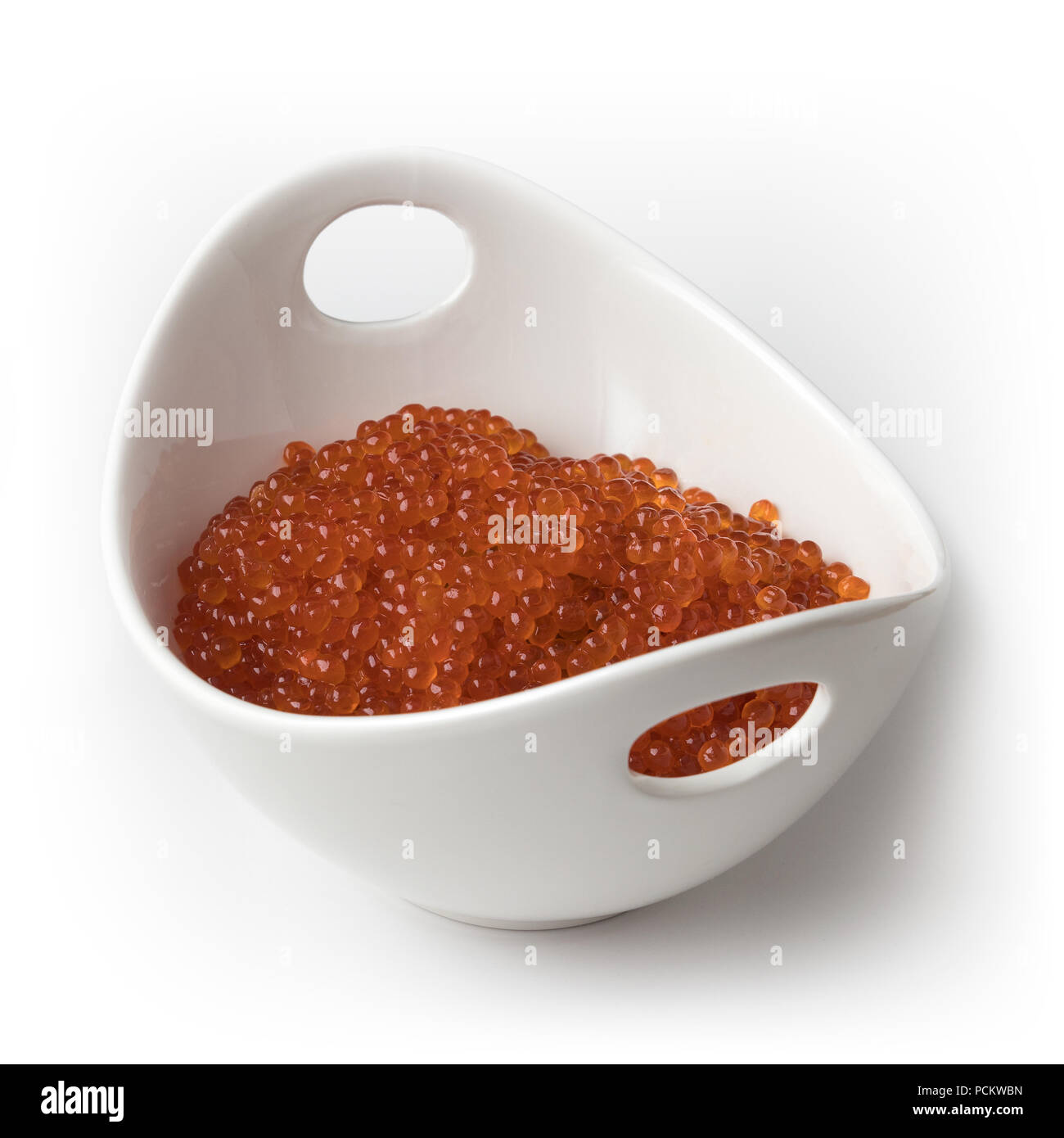 Red salmon caviar in a bowl, isolated on white Stock Photo - Alamy
