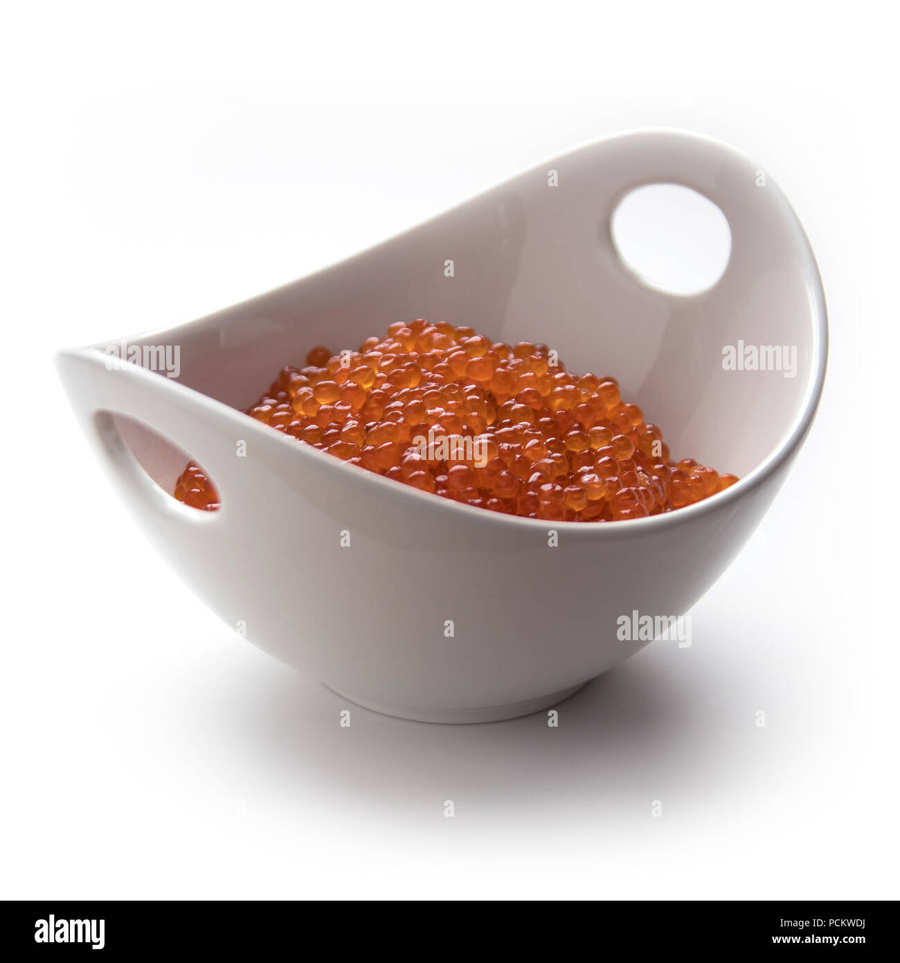 Red salmon caviar in a bowl, isolated on white Stock Photo - Alamy