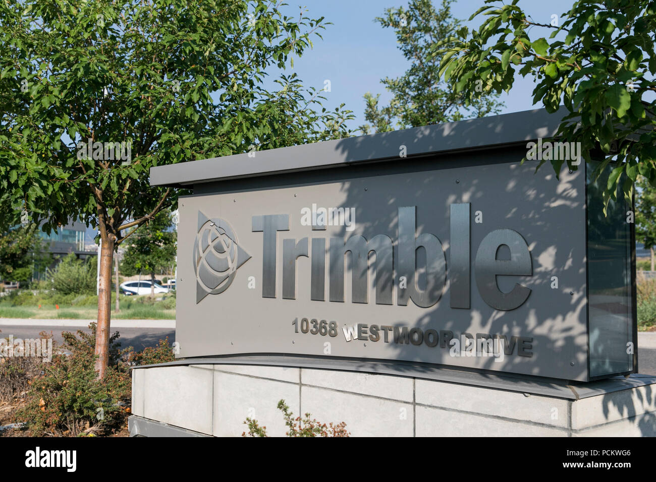 A logo sign outside of a facility occupied by Trimble, Inc., in ...