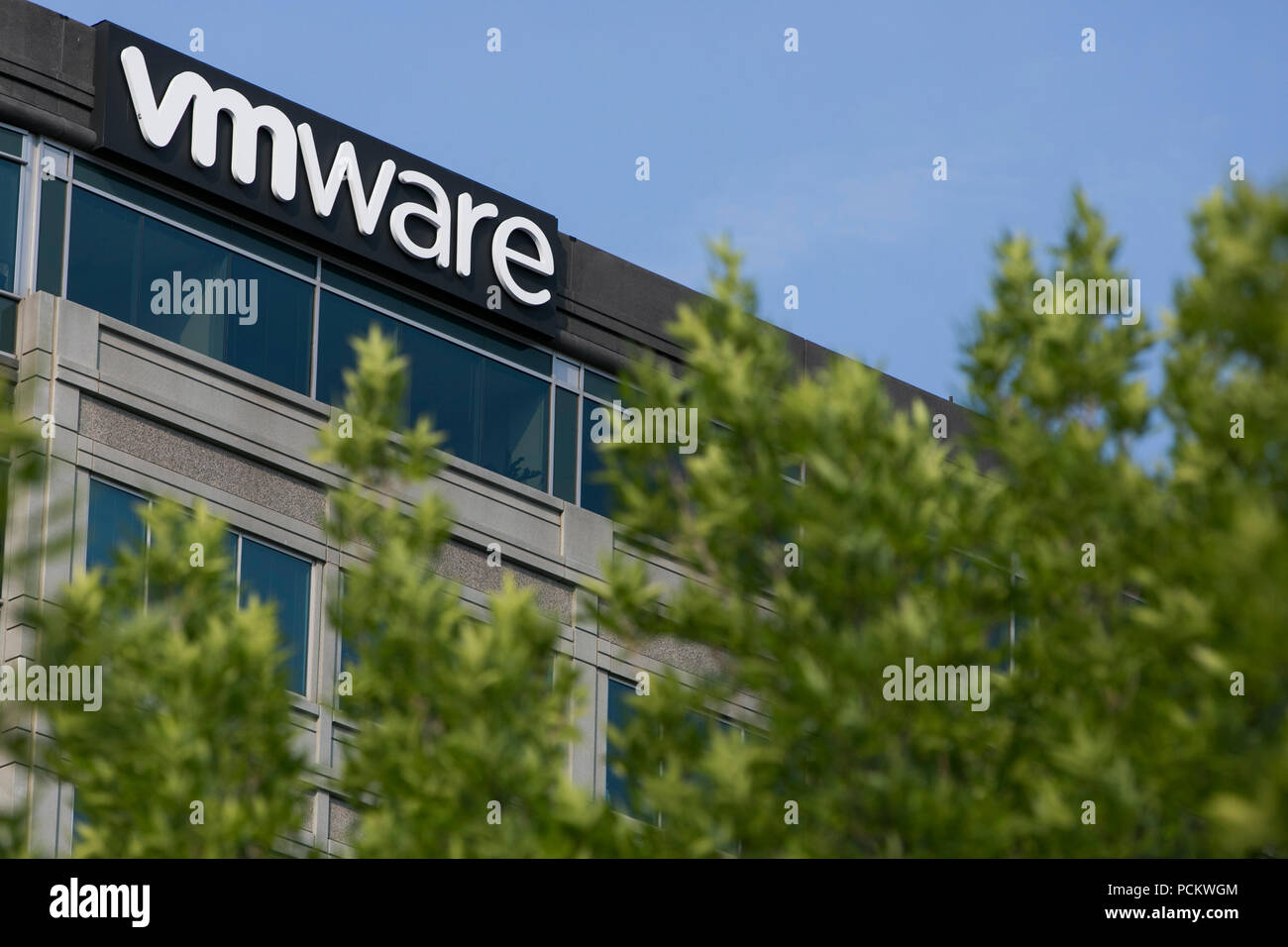 A logo sign outside of a facility occupied by VMware, Inc., in ...
